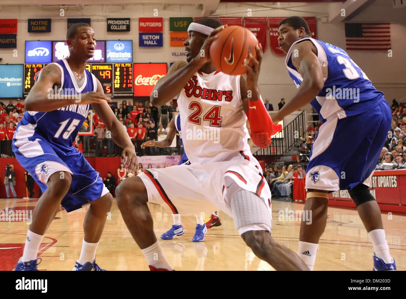 St. John's forward Justin Burrell #24 gets double teamed by Seton Hall ...