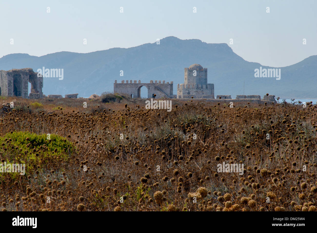 Inside Methoni Castle in the summertime with the island of Sapientza ...