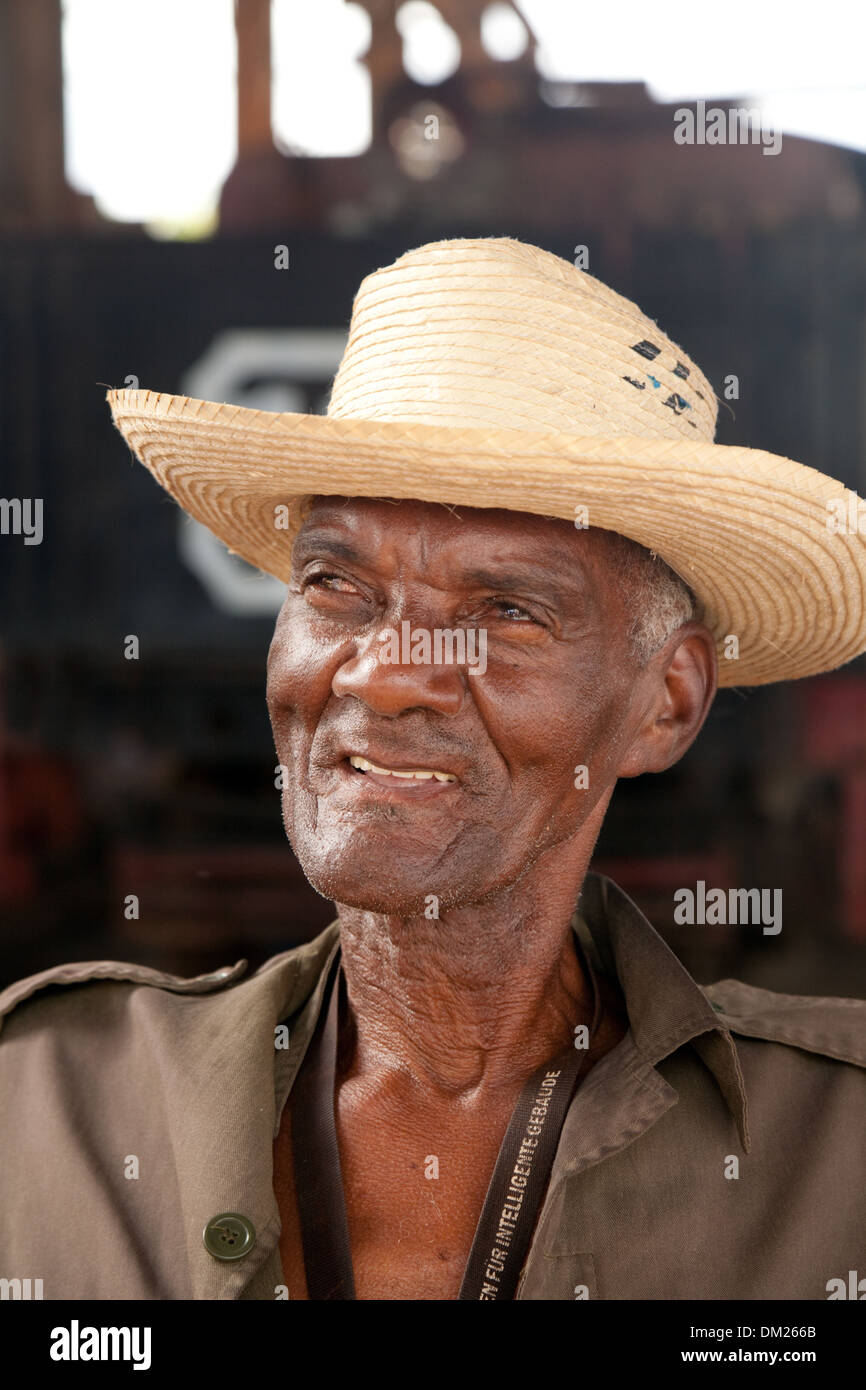 An elderly Cuban man wearing a hat, head and shoulders portrait, age ...