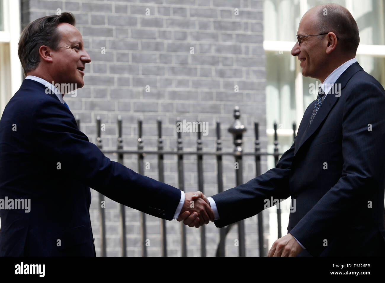 Italian Prime Minister Enrico Letta (R) shakes hands with British Prime ...