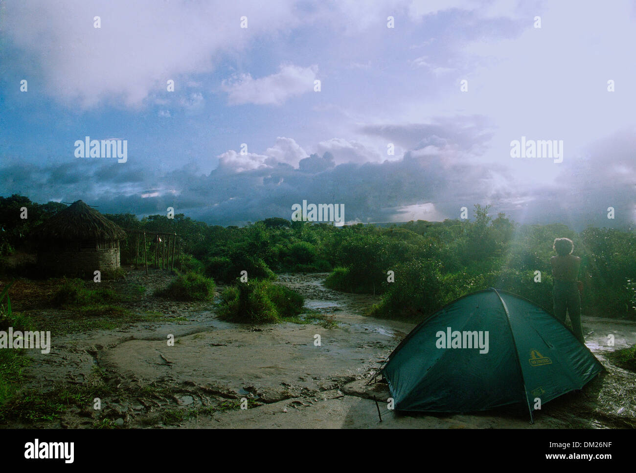 A traveler camps at the base of Roraima mountain, Canaima National Park ...