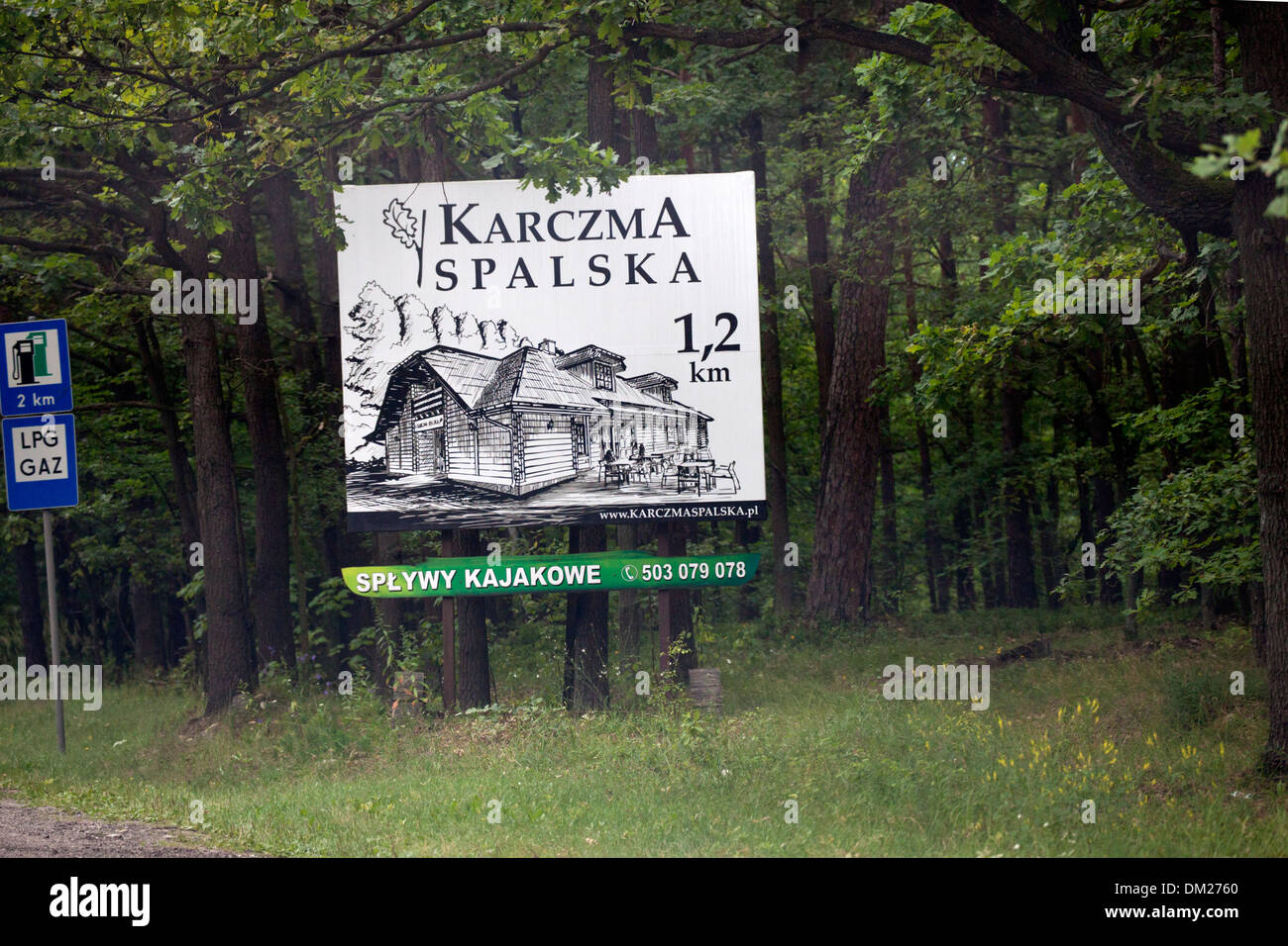 Roadside billboard advertising a Polish Karczma restaurant. Spala ...