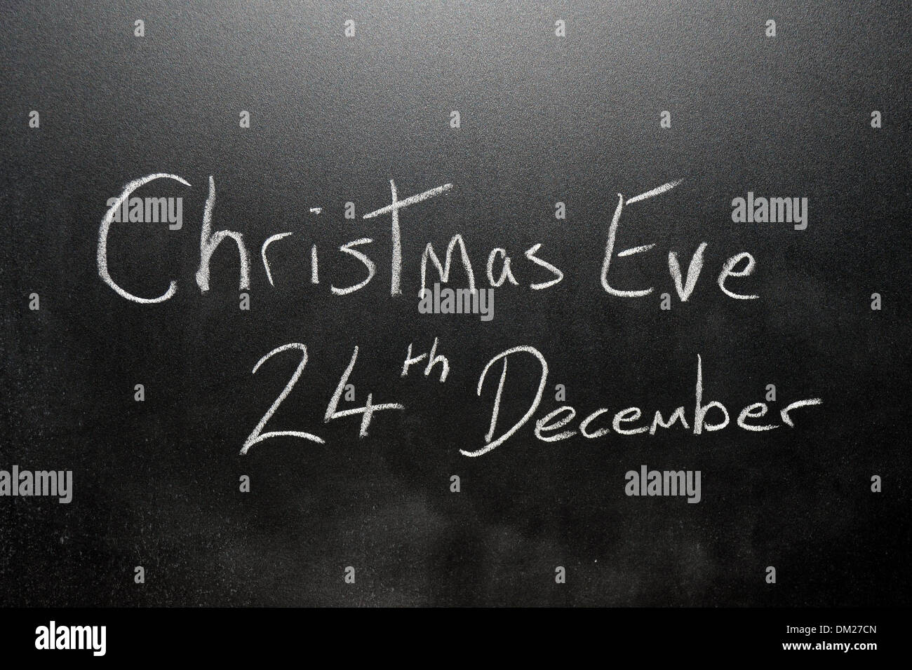 Close up of a blackboard with Christmas Eve 24th December written on it ...