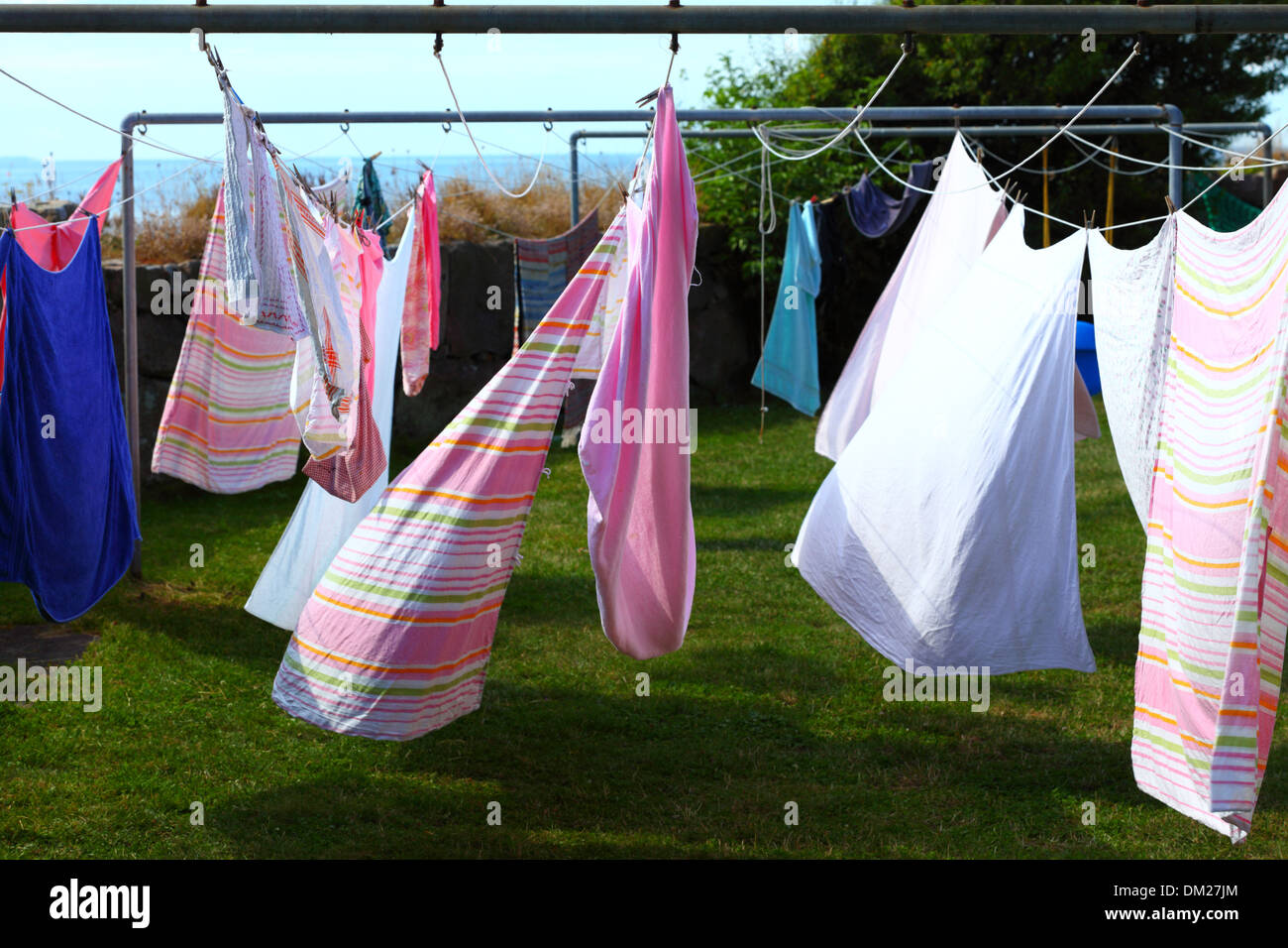 clothes hanging to dry on a laundry line outdoor Stock Photo - Alamy