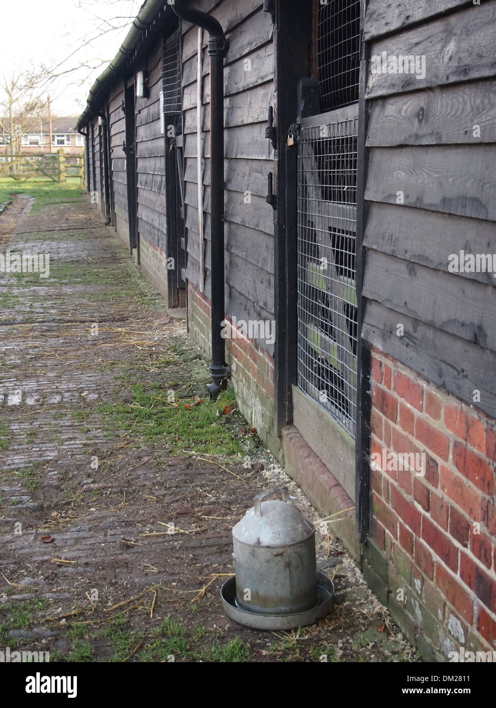 Brick base and wooden structure Stables at a farm Stock Photo - Alamy