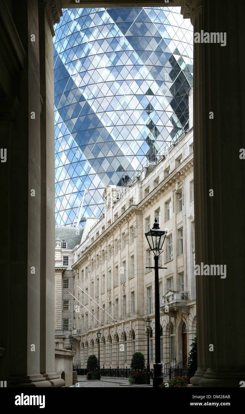 The Gherkin (Swiss Rea building) fills the skyline above terrace of ...