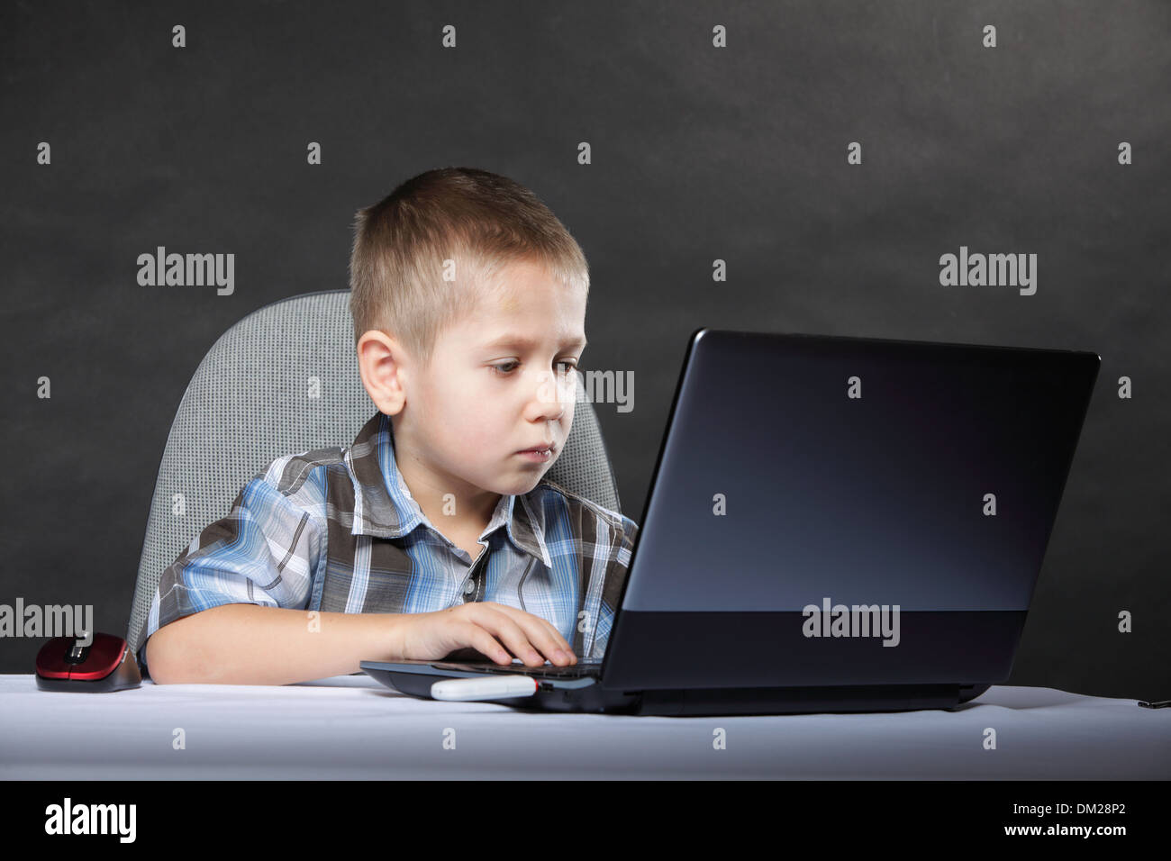 Computer addiction child boy with laptop notebook black background ...