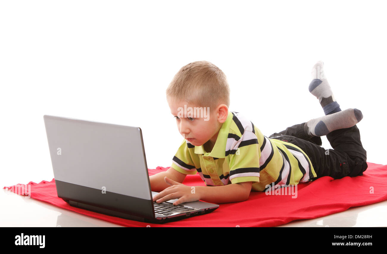 Computer addiction child boy with laptop notebook isolated on white ...