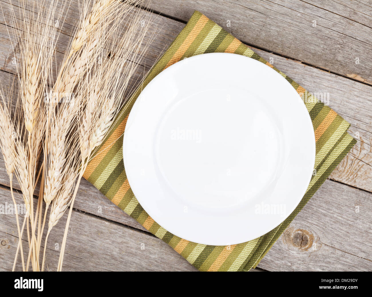 Empty plate on wood table. View from above Stock Photo - Alamy