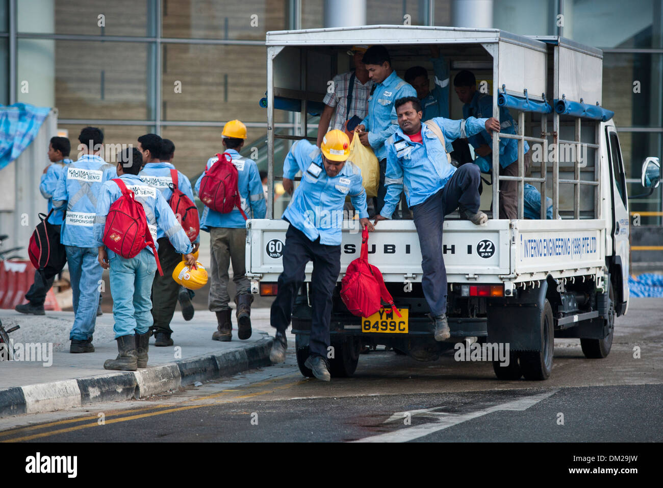 Migrant workers arrive for their shift on construction sites in the ...