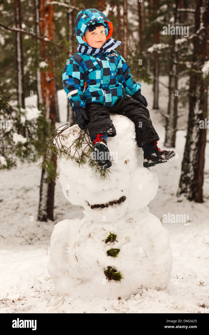 Young boy in big coat hi-res stock photography and images - Alamy