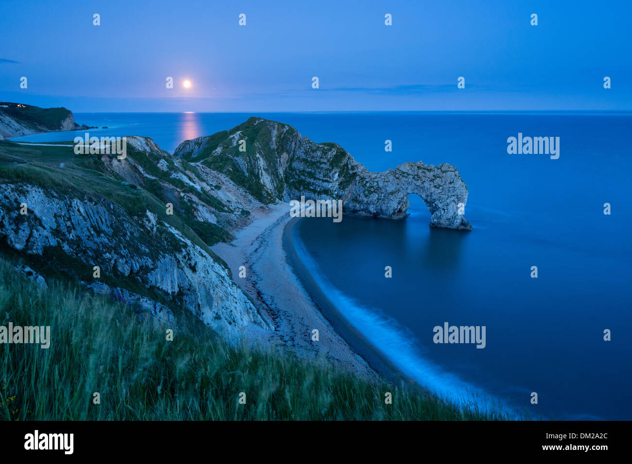 the supermoon rising over Durdle Door, Jurassic Coast, Dorset England ...