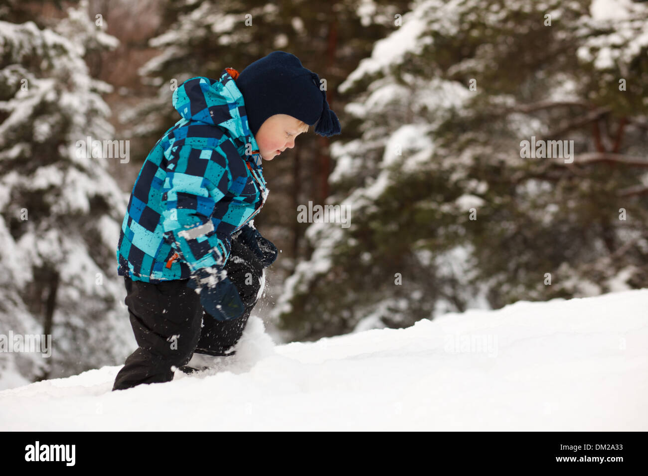 Little boy in deep snow in winter Stock Photo - Alamy