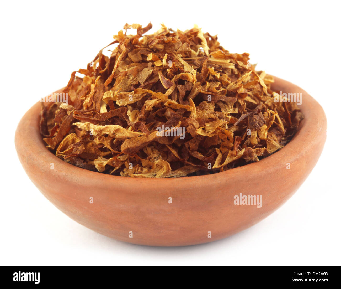Tobacco for making cigarette on a small bowl over white background ...
