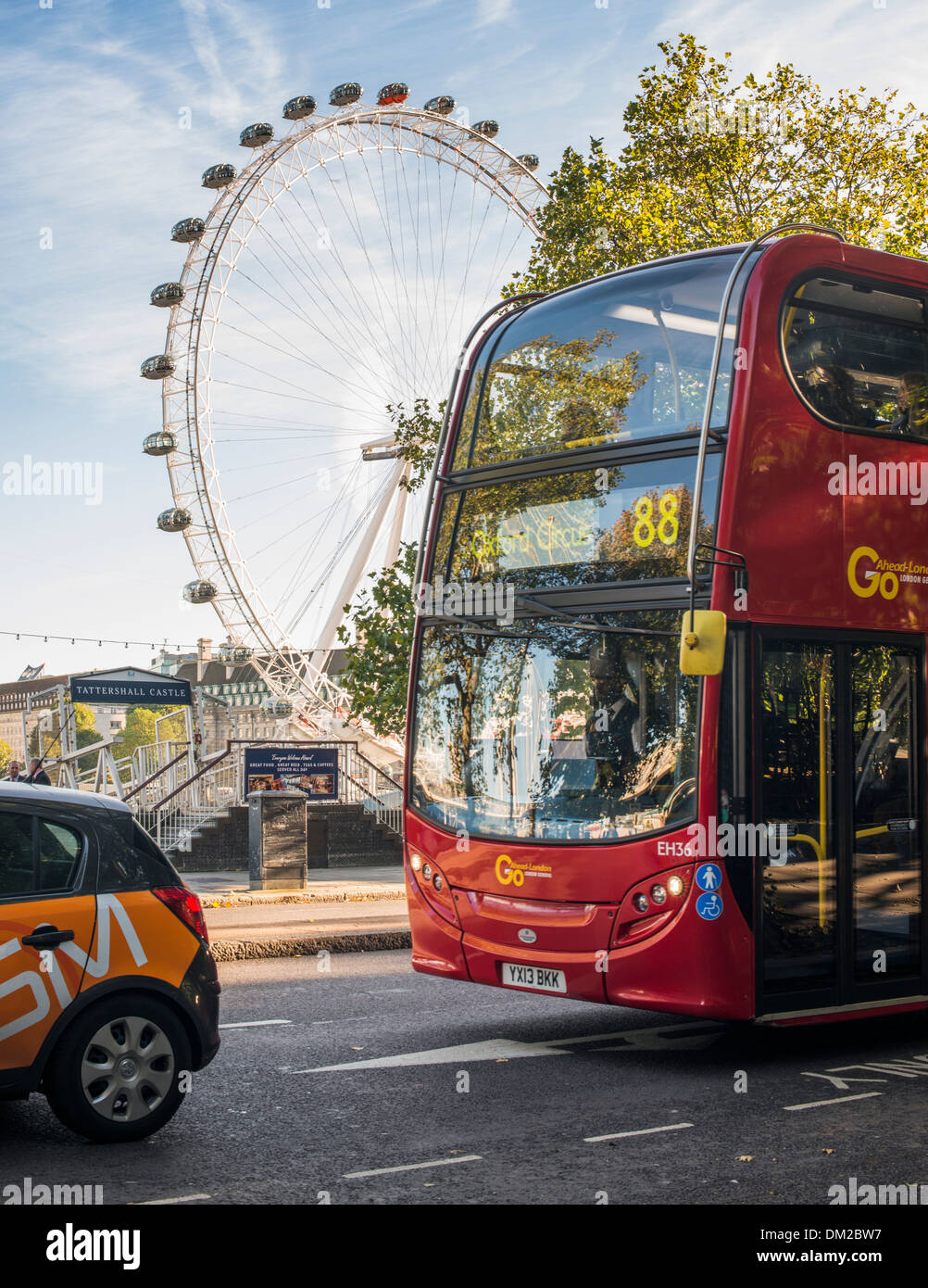Red bus on London street and The London Eye Stock Photo - Alamy