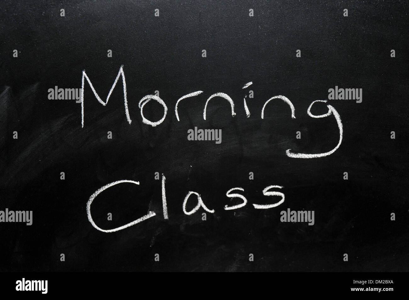 Close up of a blackboard with Morning Class written on it in chalk ...
