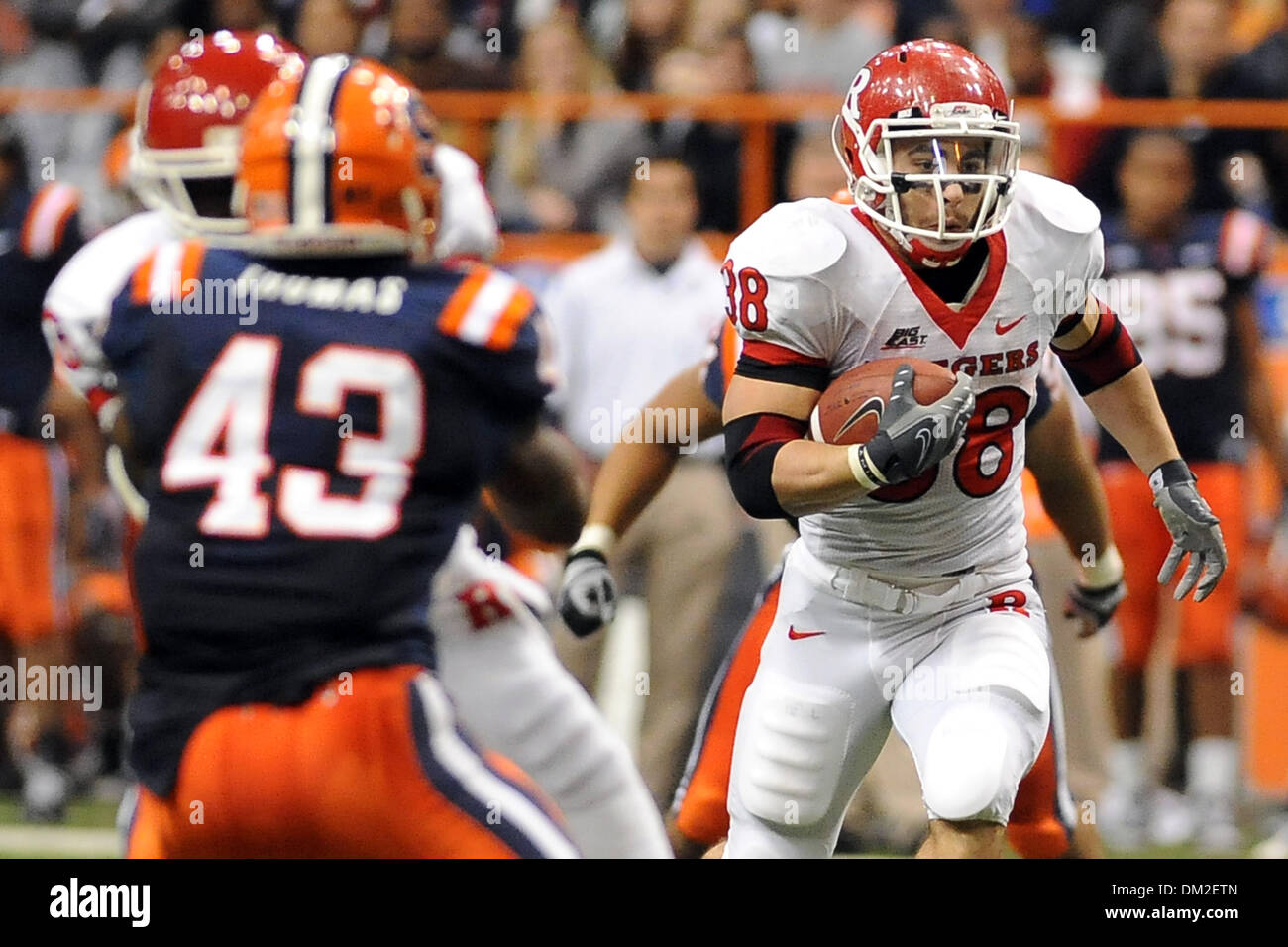 Rutgers running back Joe Martinek (38) follows his blockers for a big ...