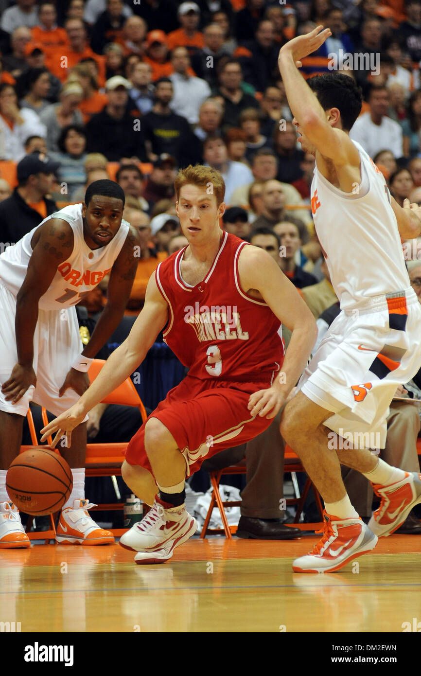 Cornell guard Chris Wroblewski (3) drives around Syracuse guard Andy ...
