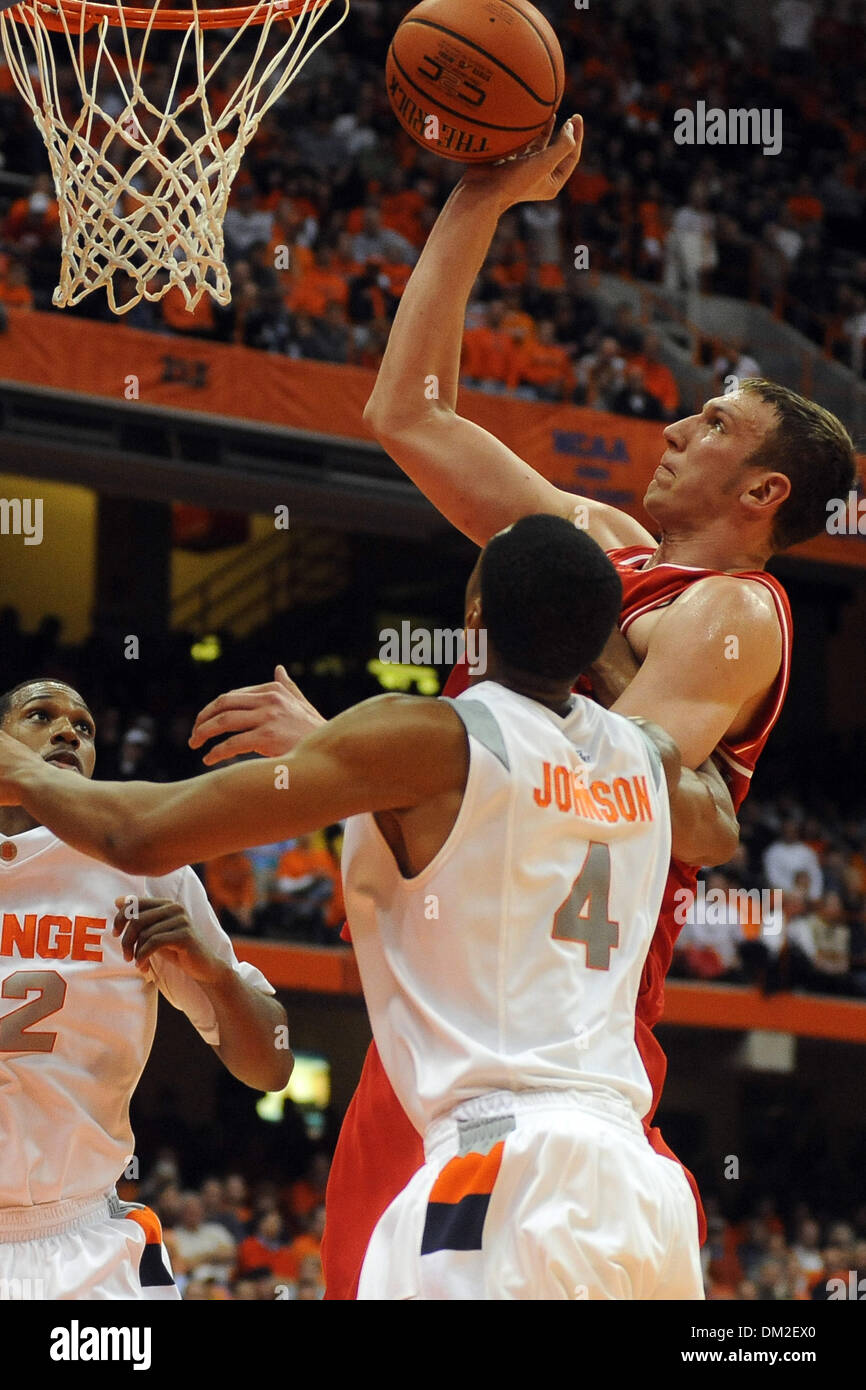 Cornell center Jeff Foote (back) goes for the lay-up in front os ...