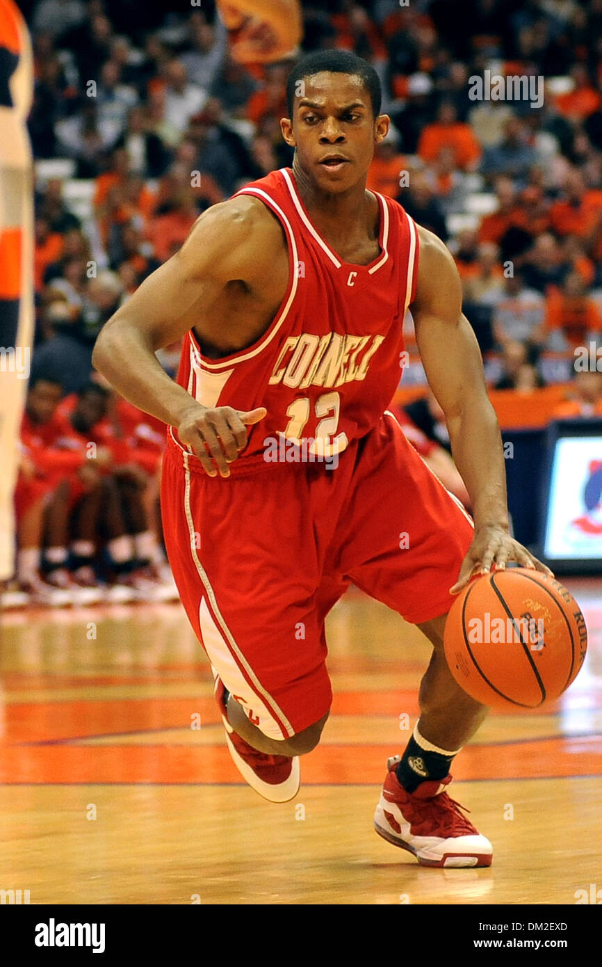 Cornell guard Louis Dale (12) dribbles through the Syracuse defense in ...