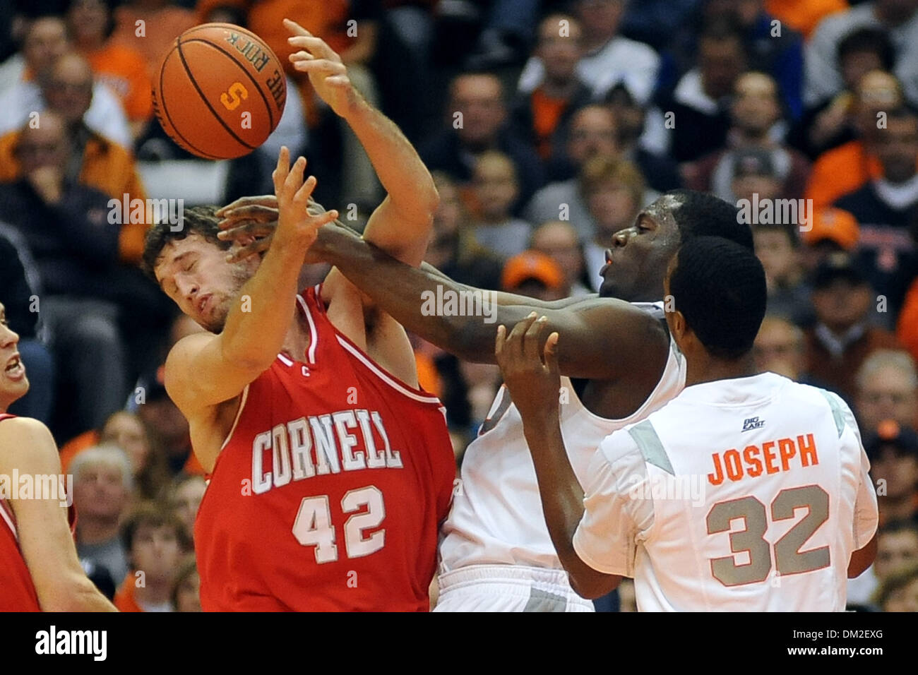 Syracuse forward Rick Jackson (0) and Cornell forward/center Mark Coury ...
