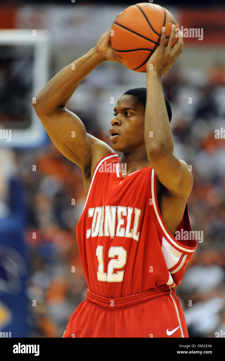 Cornell guard Louis Dale (12) looks for a teammate as the Big Red take ...