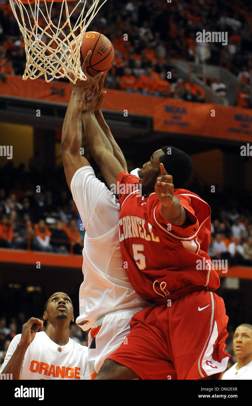 Cornell forward Errick Peck (5) tries to take the rebound away from ...