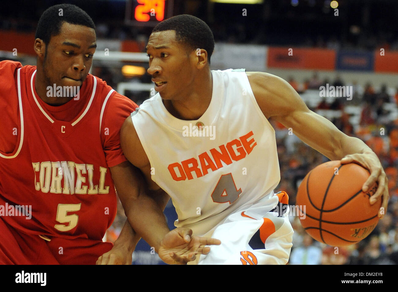 Syracuse forward Wesley Johnson (4) drives to the hoop on Cornell ...
