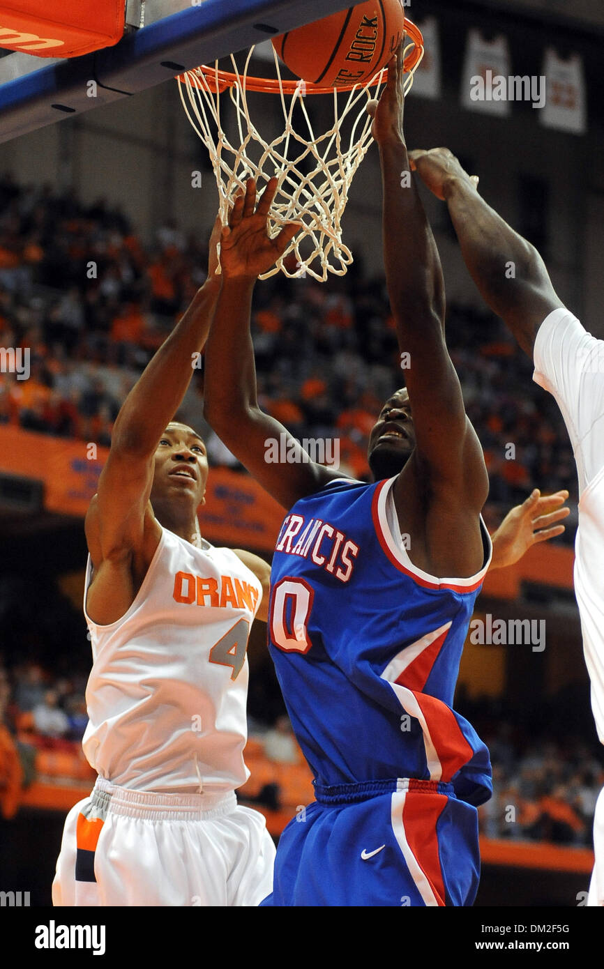 St. Francis (NY) forward Akeem Johnson (30) tries to tip the shot in as ...