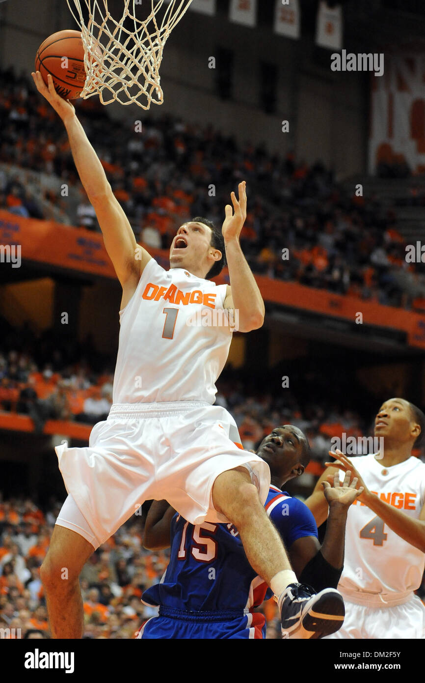 Syracuse guard Andy Rautins (1) soars to the basket in front of St ...