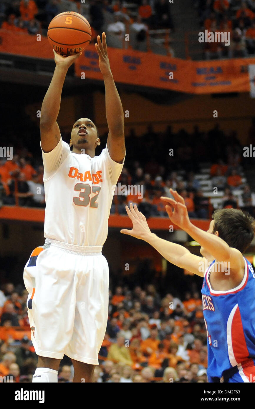 Syracuse forward Kris Joseph (32) takes the shot from the top of the ...