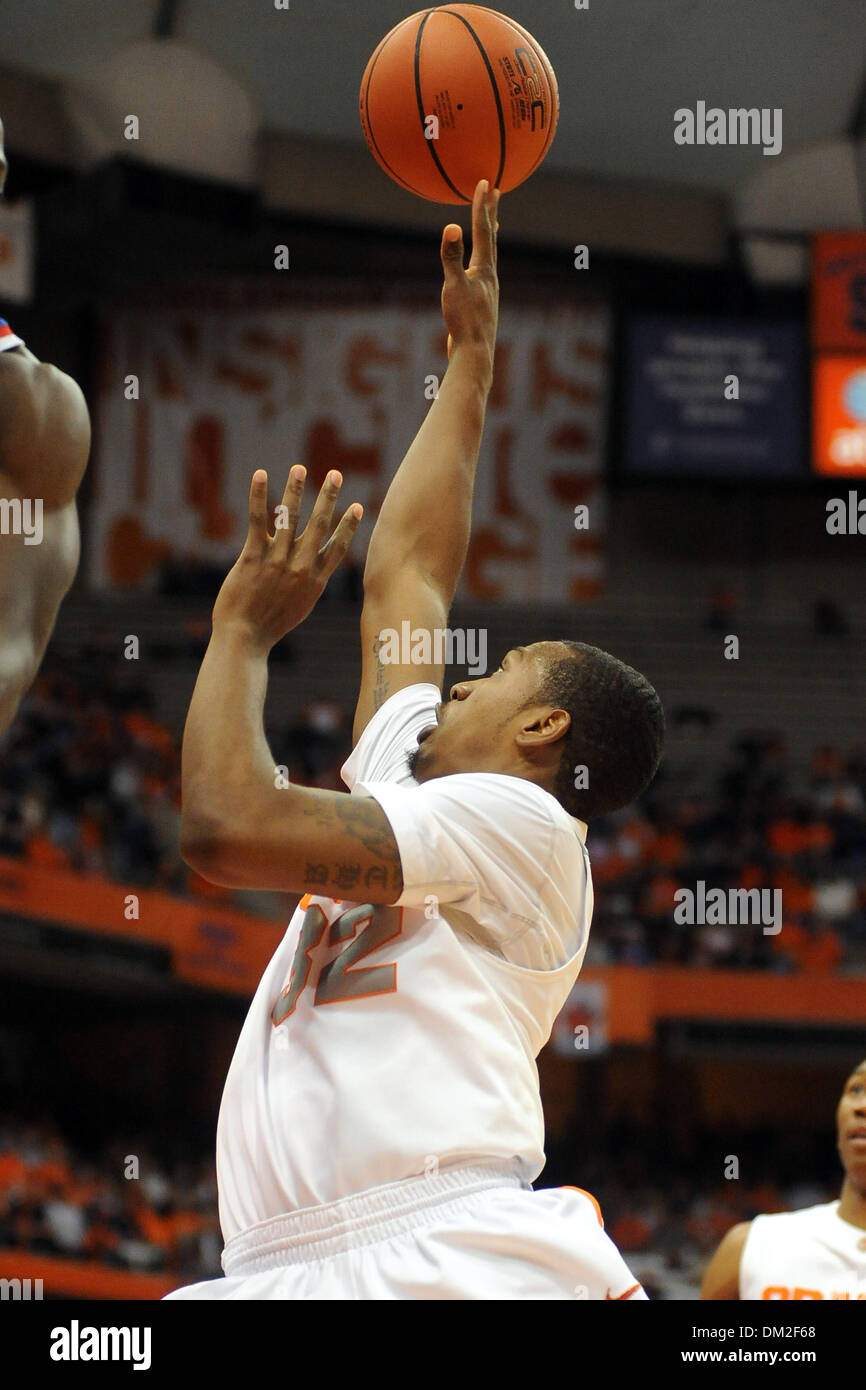 Syracuse forward Kris Joseph (32) lets the shot fly from his finger ...