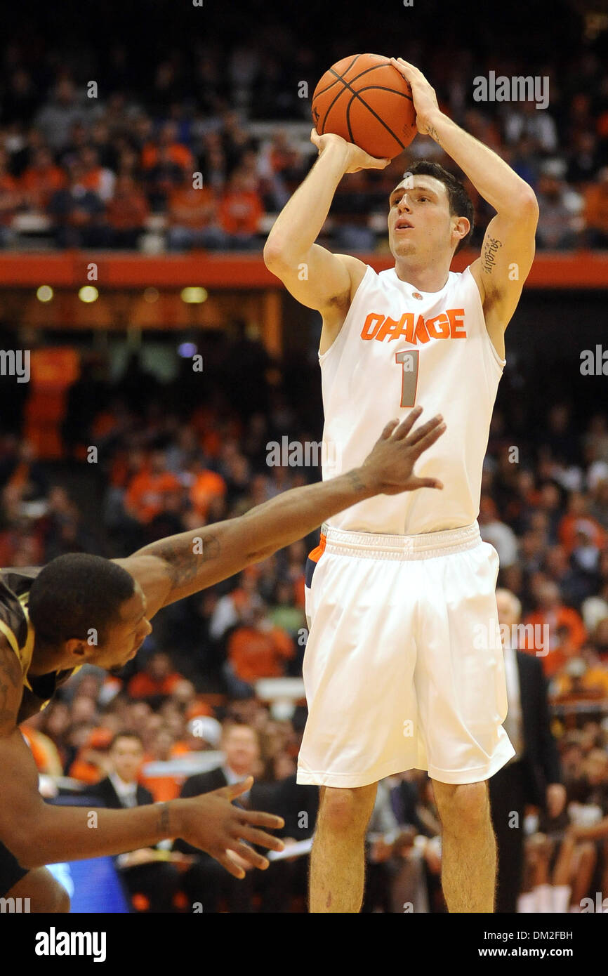 Syracuse guard Andy Rautins (1) launches a three point shot to spark ...