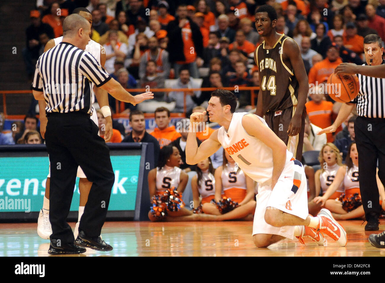 Syracuse guard Andy Rautins (1) looks up at the referee in pain after ...