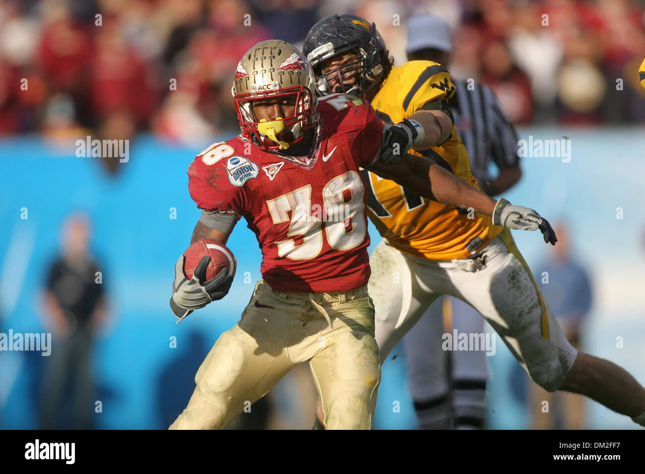 Florida State running back Jermaine Thomas (38) avoids a tackle by West ...