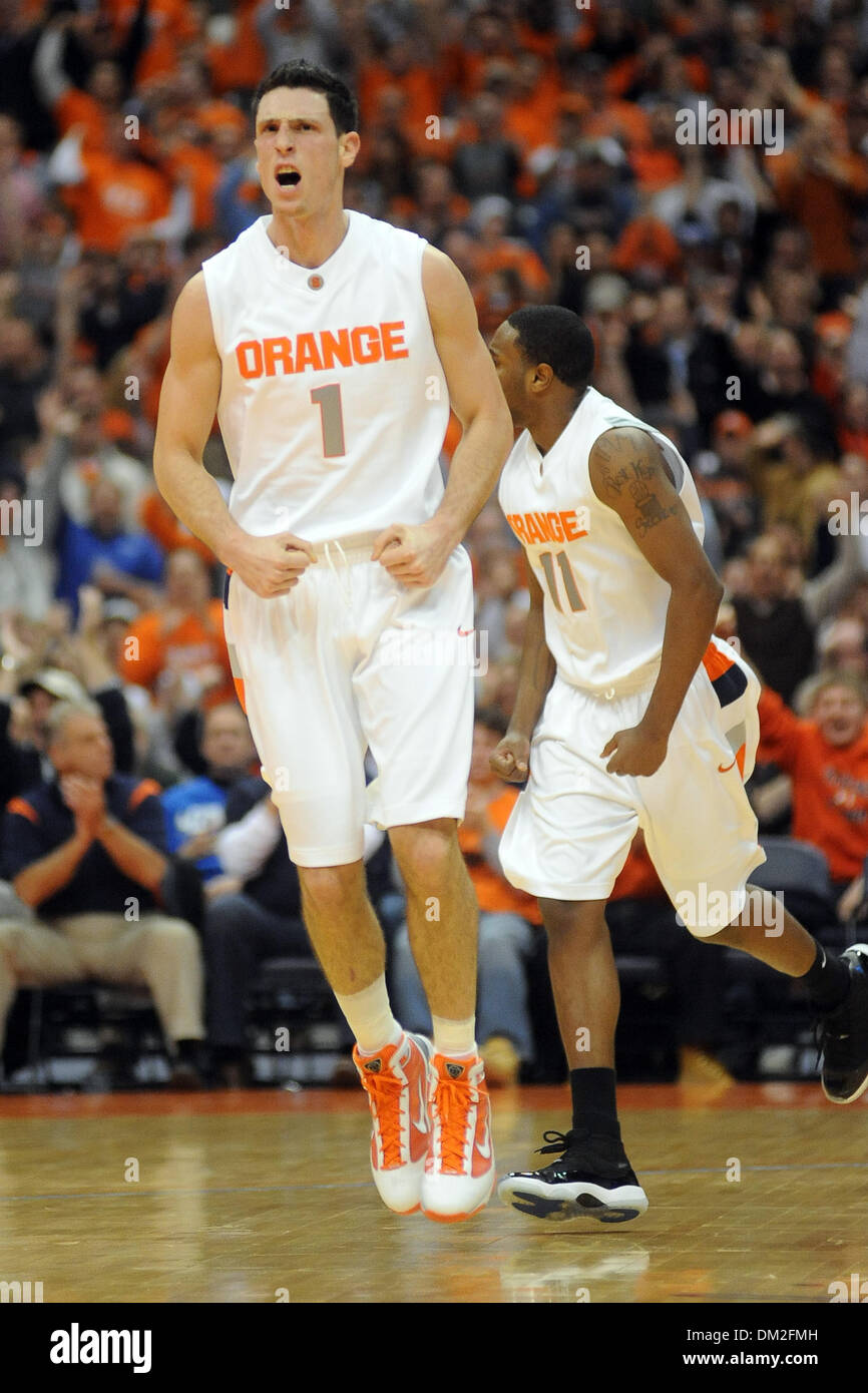 Syracuse guard Andy Rautins (1) reacts to sinking the three point shot ...