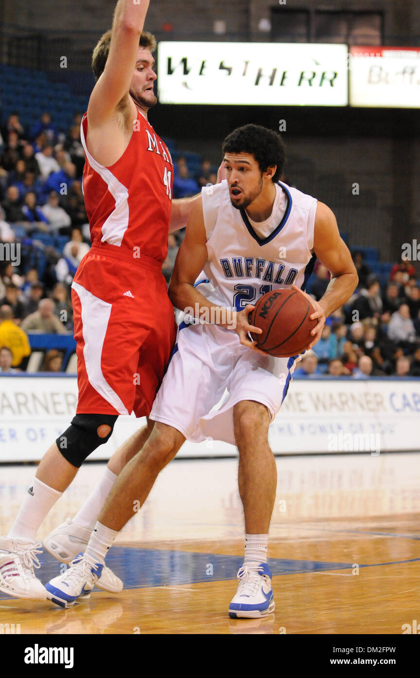 Buffalo Bulls forward Mitchell Watt (21) is guarded by Adam Fletcher ...