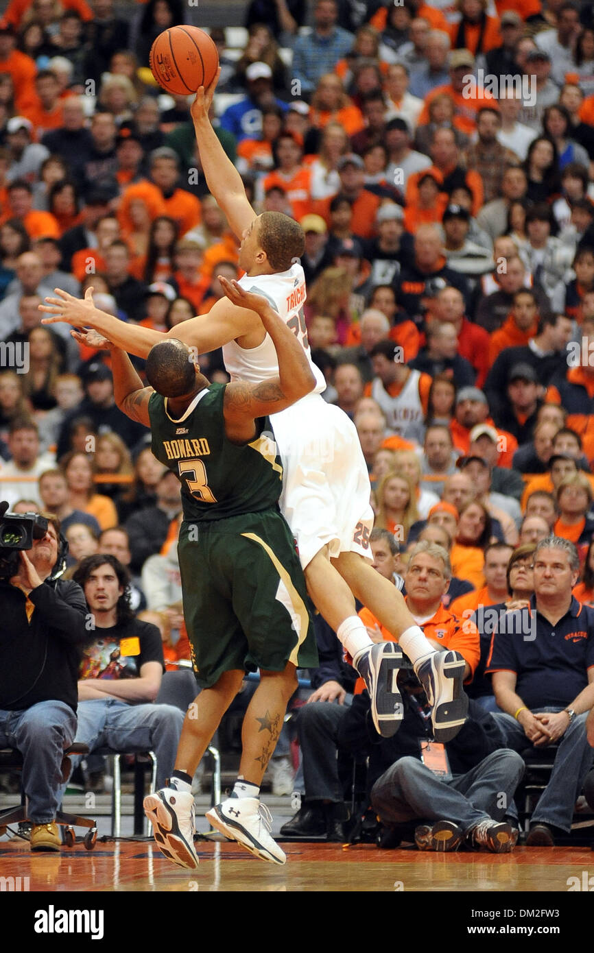 Syracuse guard Brandon Triche (right) glides to the hoop in the first ...