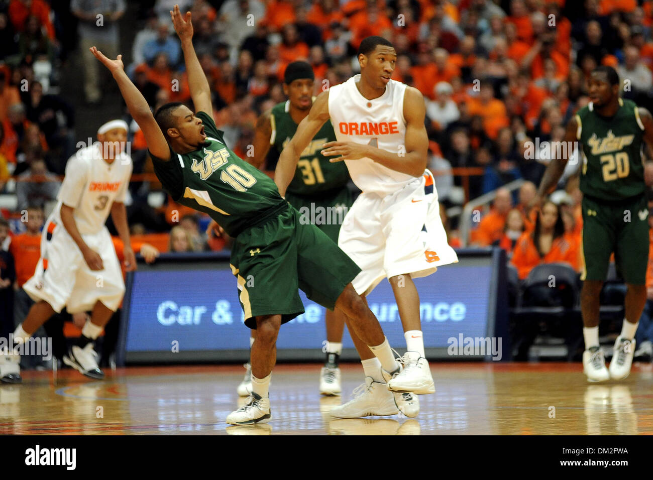South Florida guard Anthony Crater (10) tries to draw the foul after ...