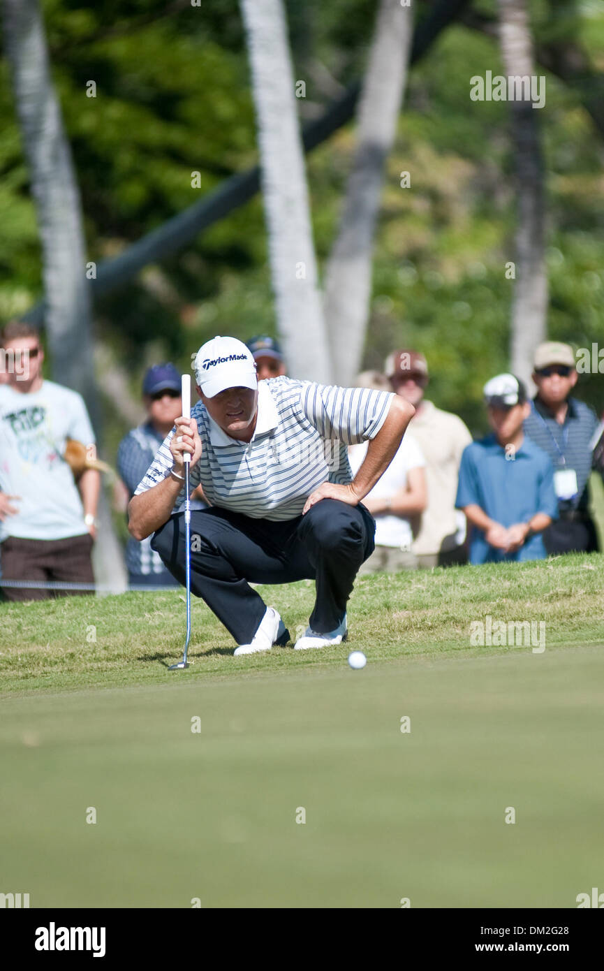 Ryan Palmer lines up his putt on the 6th hole at Waialae. The final ...