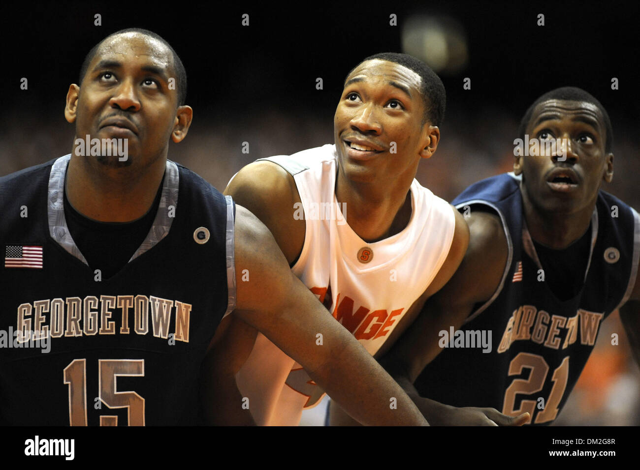 Syracuse forward Wesley Johnson (4) lines up in between Georgetown ...