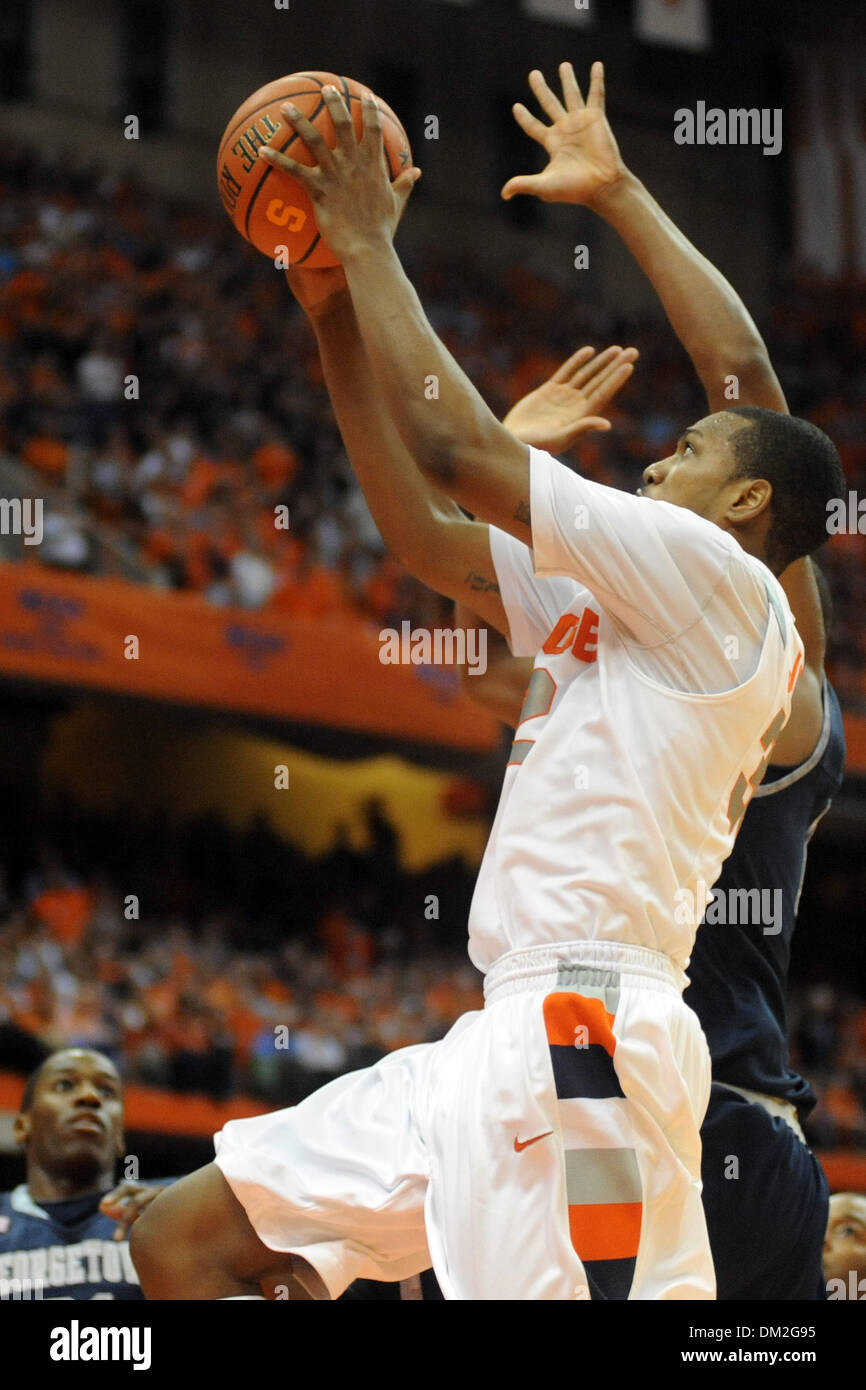 Syracuse forward Kris Joseph (32) soars to the hoop before being fouled ...