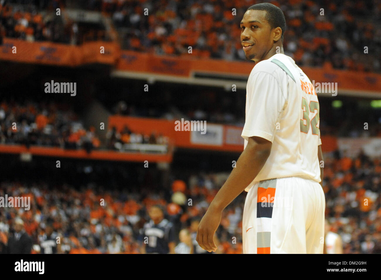 Syracuse forward Kris Joseph (32) responds to hearing his name called ...
