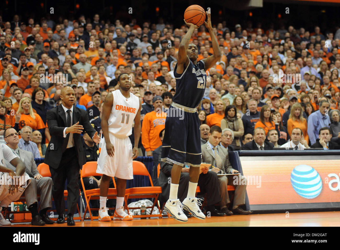 Georgetown guard Jason Clark (21) takes a three point shot in front of ...
