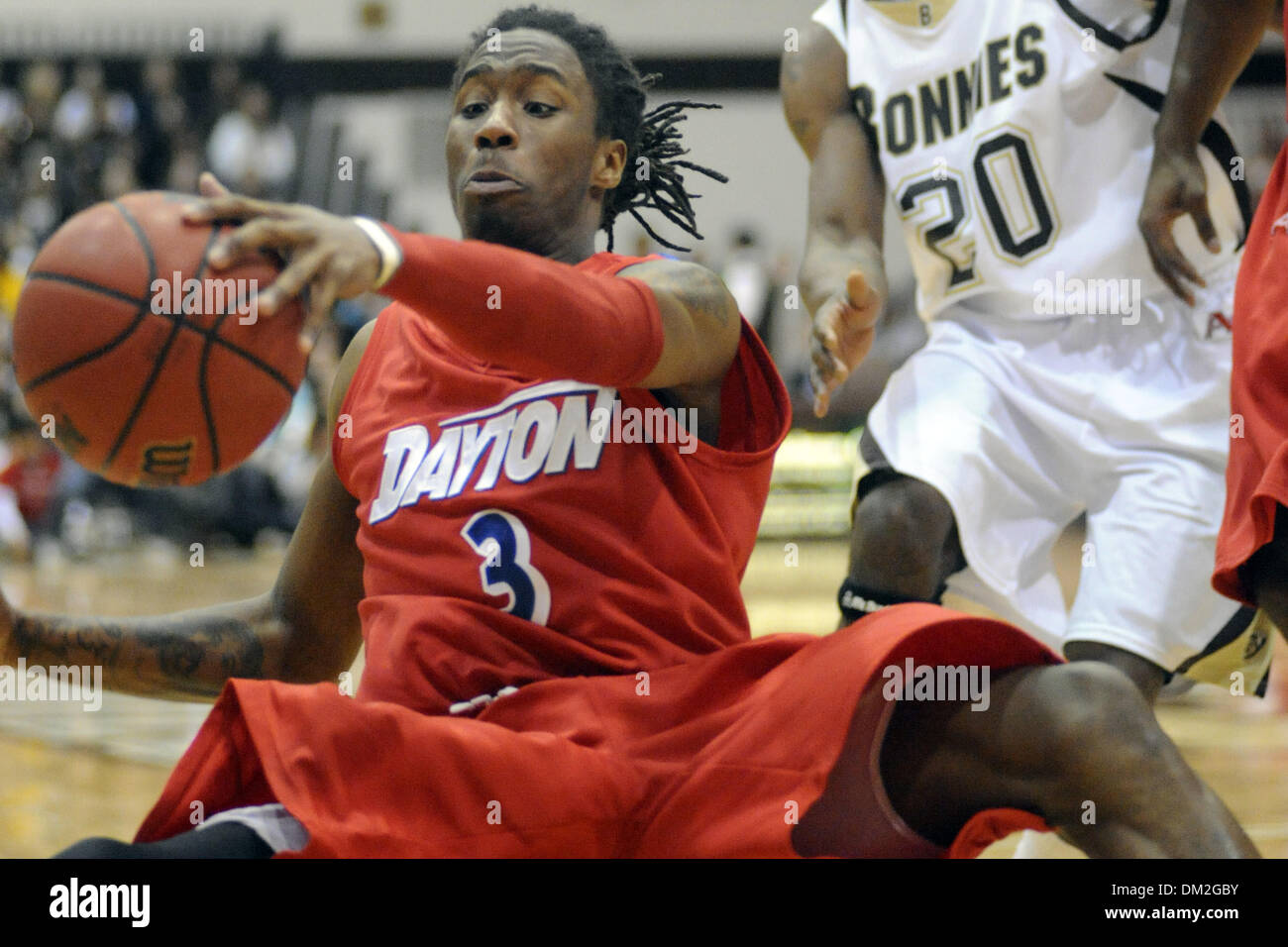 Dayton guard Rob Lowery (3) grabs the ball while falling to the floor ...