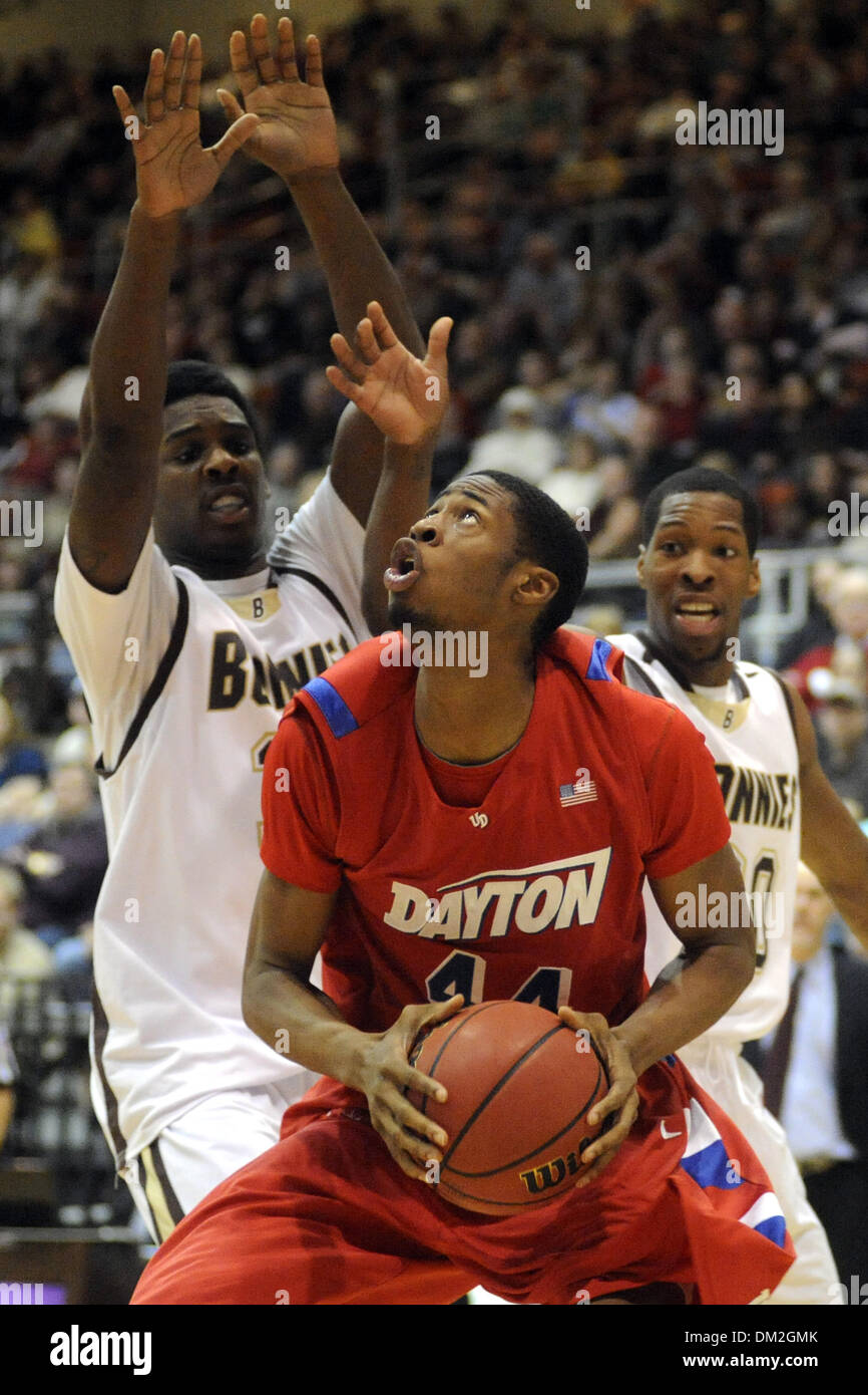 Dayton forward/center Josh Benson (44) pump fakes to get the St ...