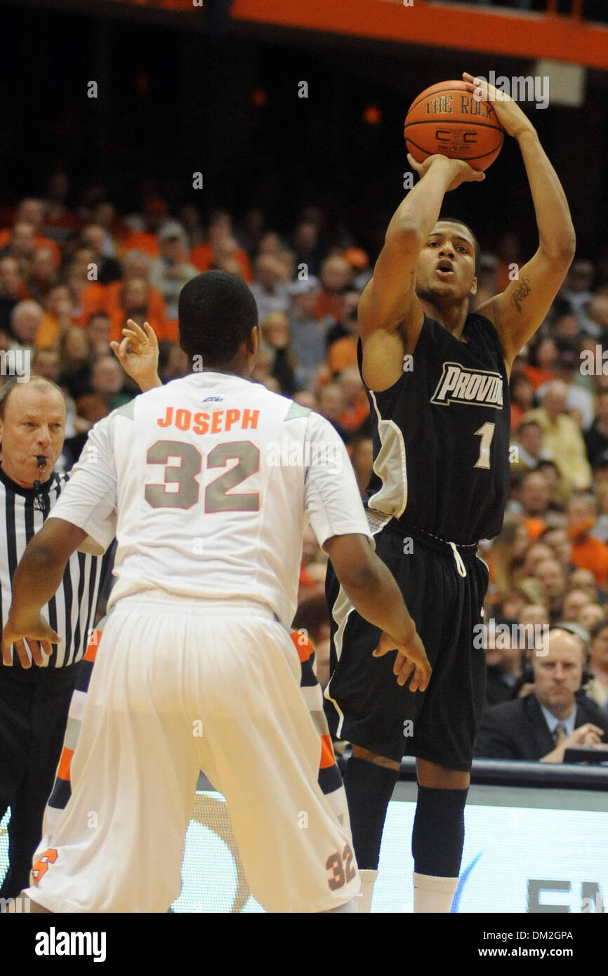 Providence guard Duke Mondy (1) takes a three over the Syracuse defense ...