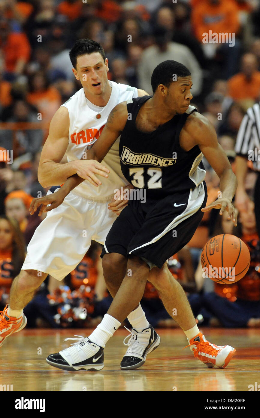 Providence guard Vincent Council (32) spins away from the in the shorts ...