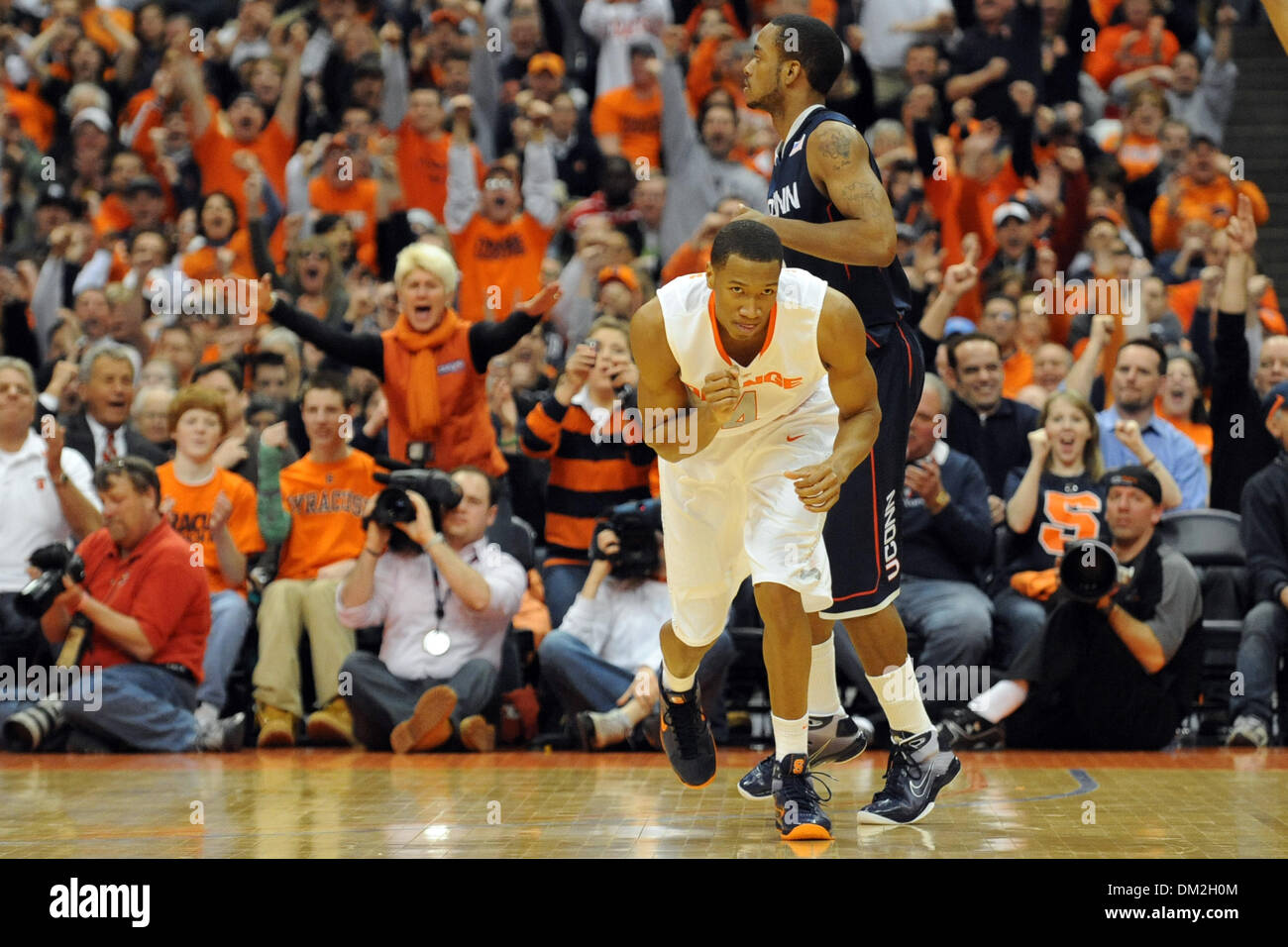 Syracuse forward Wesley Johnson (4) celebrates after hitting the three ...