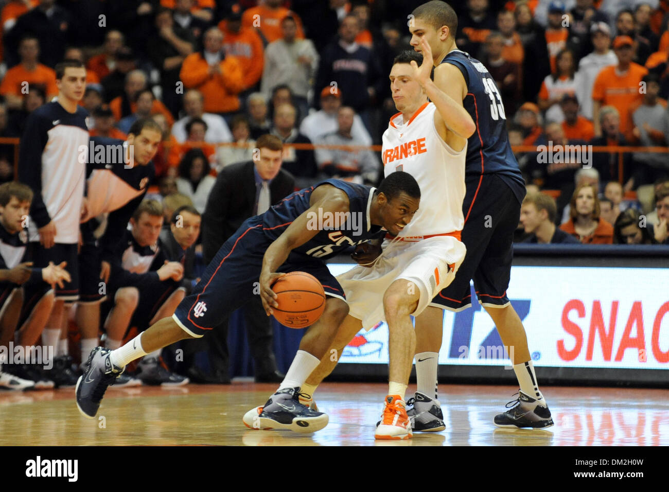 Connecticut guard Kemba Walker (15) pushes Syracuse guard Andy Rautins ...